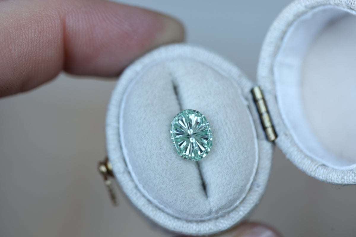 1.45ct oval light green blue sapphire, Starbrite cut by John Dyer – Oore Jewelry